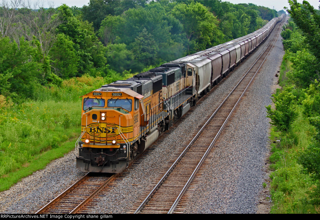 BNSF 9892 Roars Wb with a grain train Double Mac's.